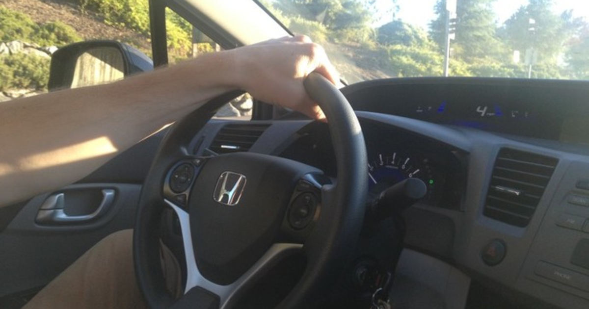 Why do men drive with one hand at the top of the steering wheel ...