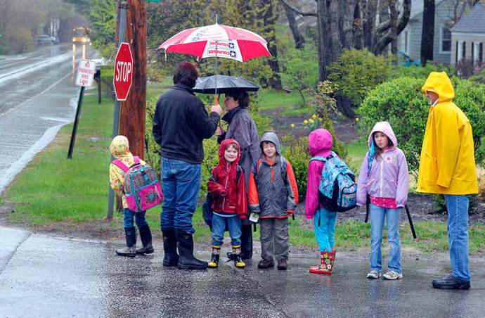 How should kids WAIT for the SCHOOL BUS when it's RAINING? - GirlsAskGuys